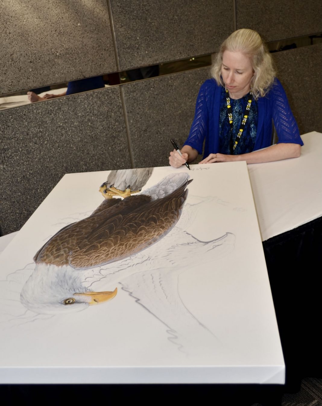 Emily Damstra Signs and Donates Artwork | CoinNews